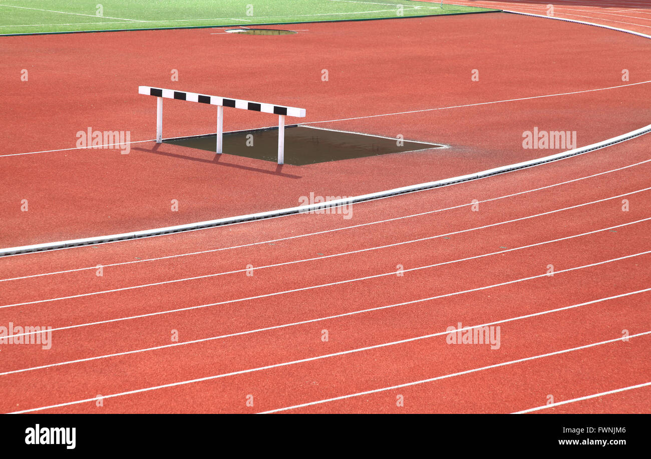 Hurdle and Curve of Race Track in Stadium Stock Photo - Alamy