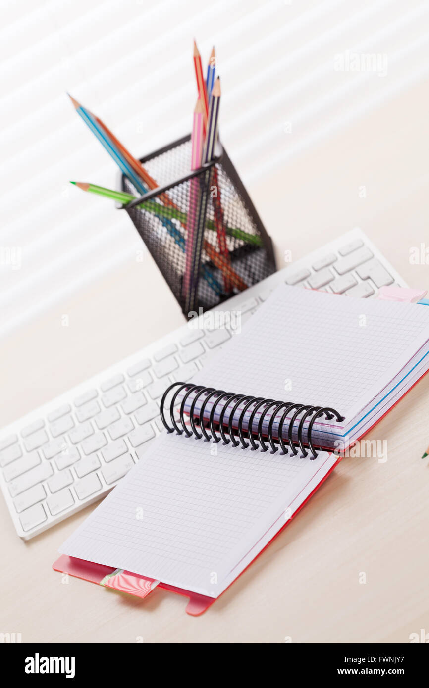 Office workplace with pc, notepad and pencils on wood desk table in ...