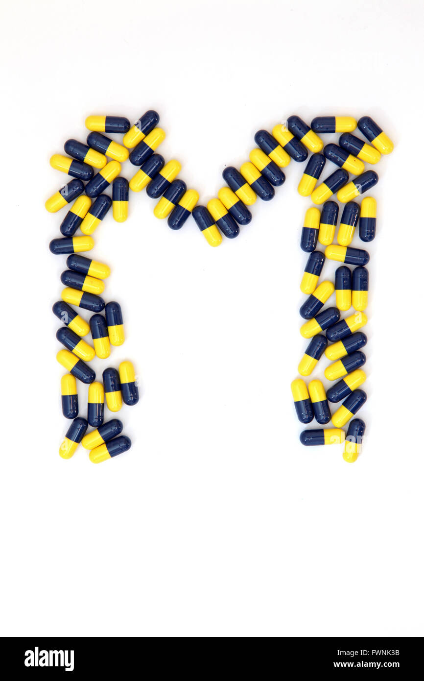 The letter M alphabet made of medical capsules Stock Photo - Alamy