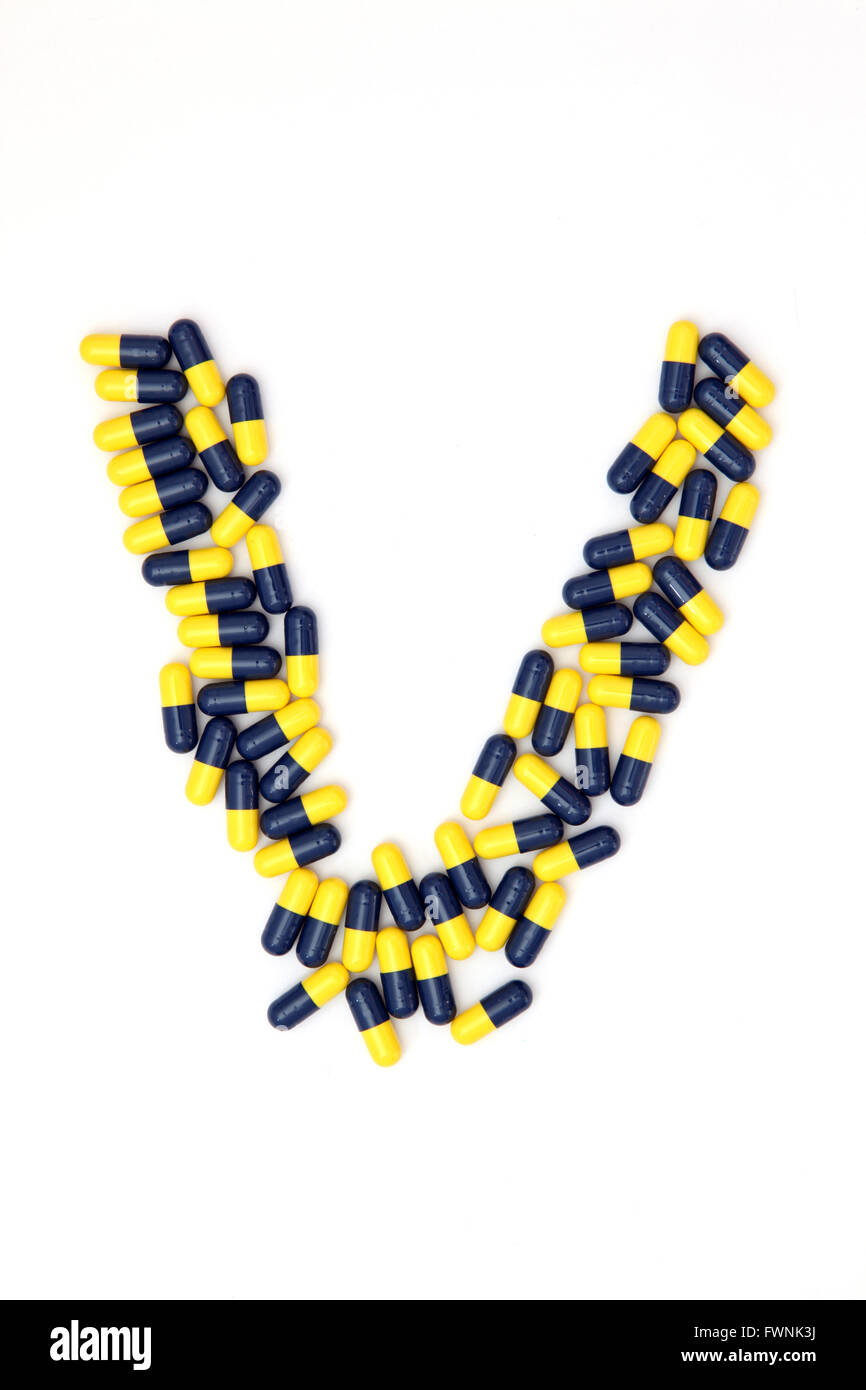 The letter V alphabet made of medical capsules Stock Photo - Alamy