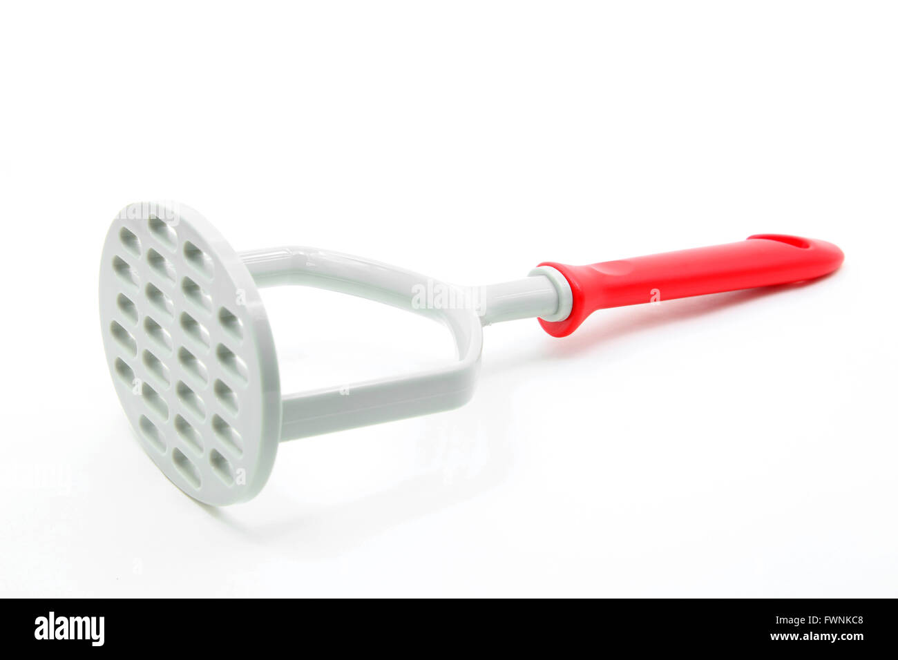 studio shot of plastic potato masher isolated on white background Stock ...