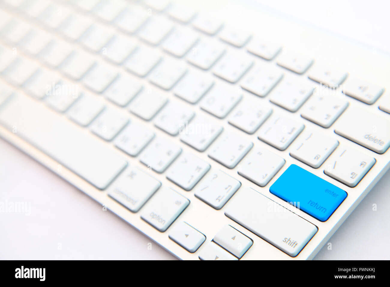 perspective of light blue return button on white modern keyboard Stock ...