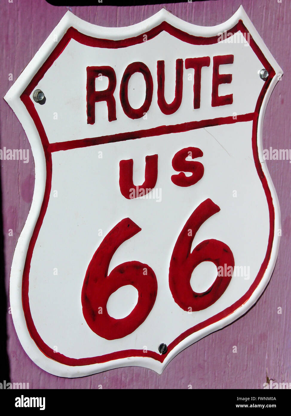 vintage sign route 66 on purple wall Stock Photo - Alamy