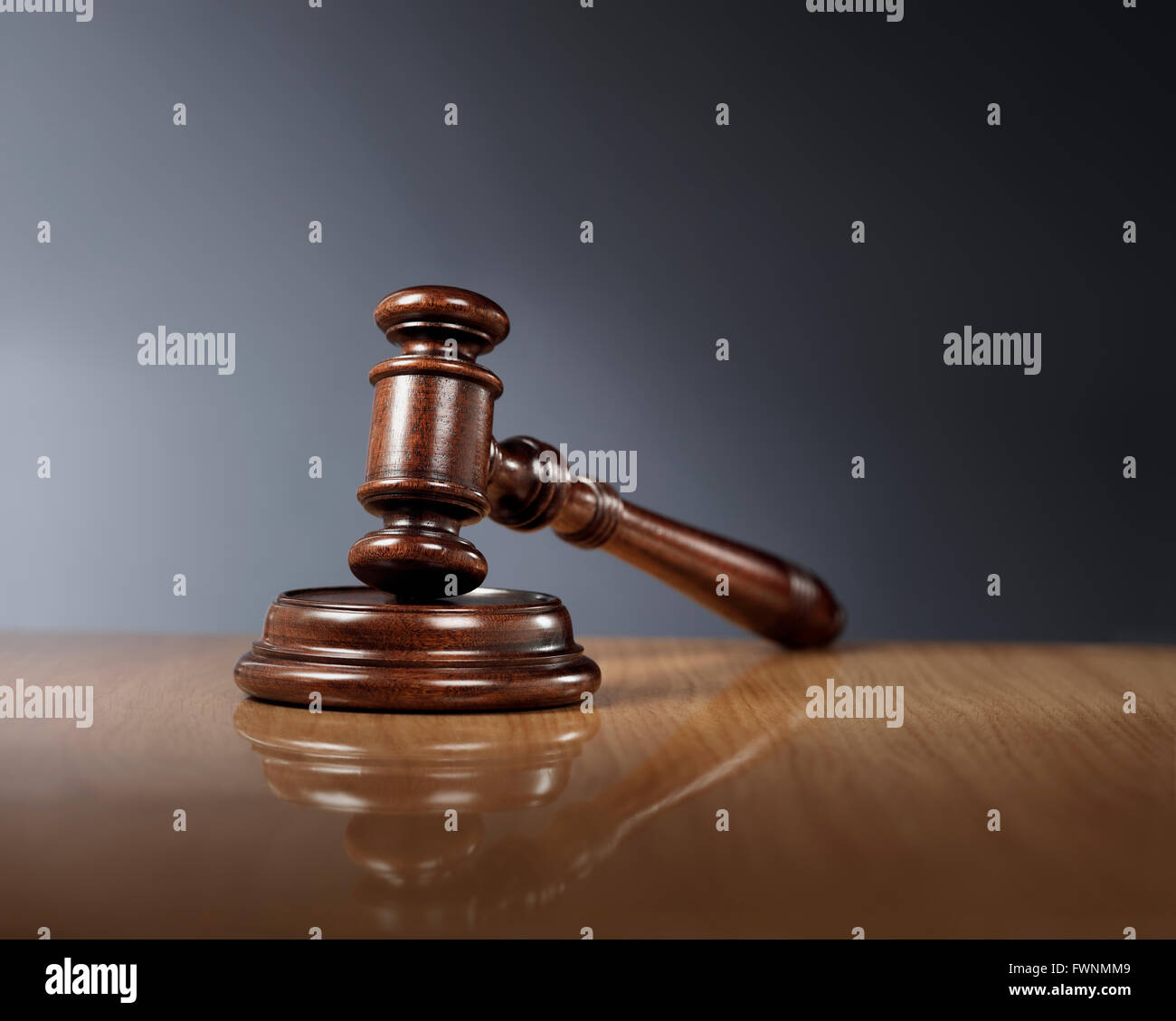 Mahogany wooden gavel on glossy wooden table Stock Photo - Alamy