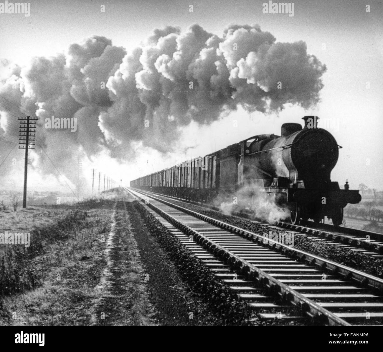 A Great Central Class 04 2-8-0 heads a fitted freight of perishables ...