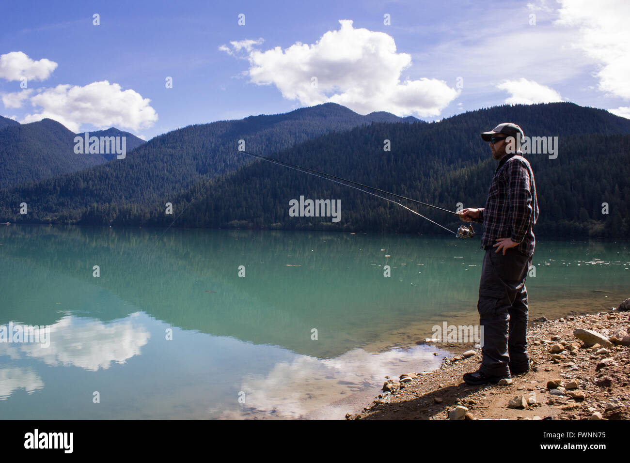 Portrait of Fisherman at Lake Shore Stock Photo - Alamy
