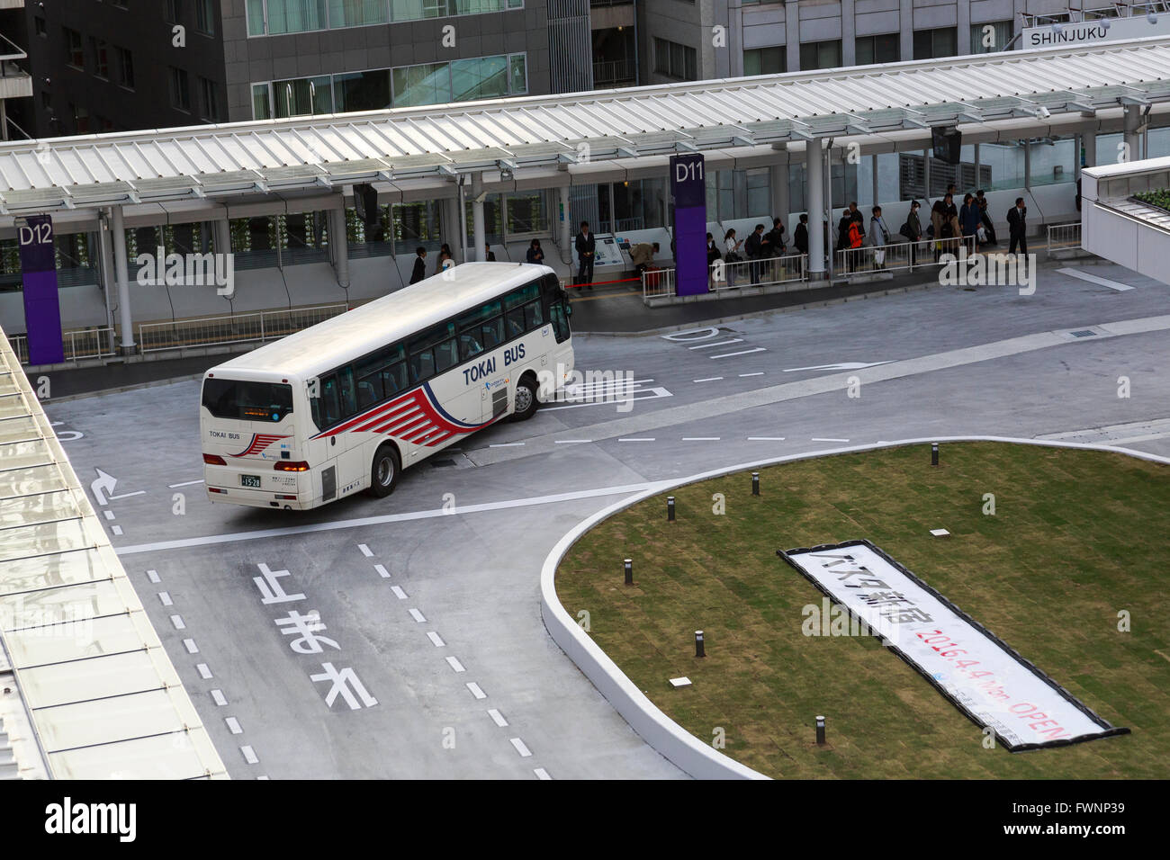 Tokyo, Japan. 6th April, 2016. Passengers line up to board a bus at the ...