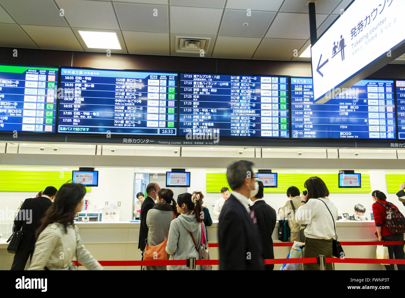 Tokyo, Japan. 6th April, 2016. Passengers line up to buy bus tickets at ...