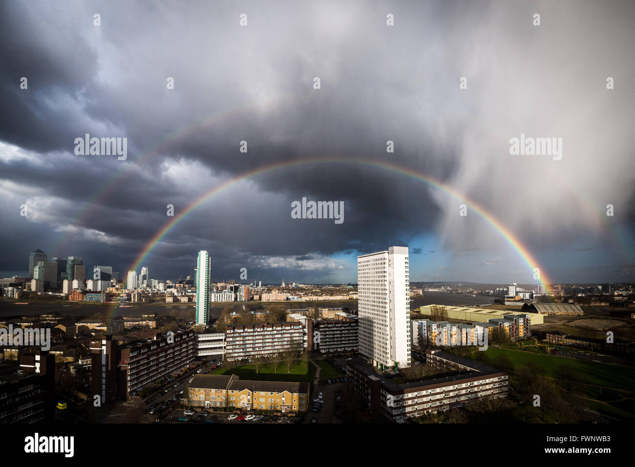 London, UK. 6th April, 2016. UK Weather: Colourful rainbow breaks ...