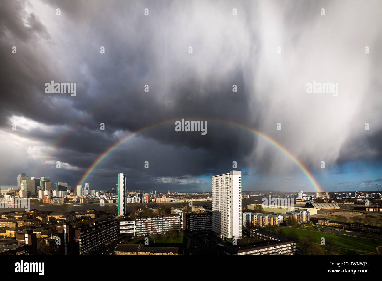 London, UK. 6th April, 2016. UK Weather: Colourful rainbow breaks ...