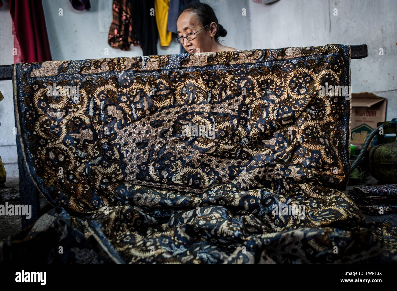 Lasem, Indonesia. 6th Apr, 2016. An old woman does batik at Maranatha ...