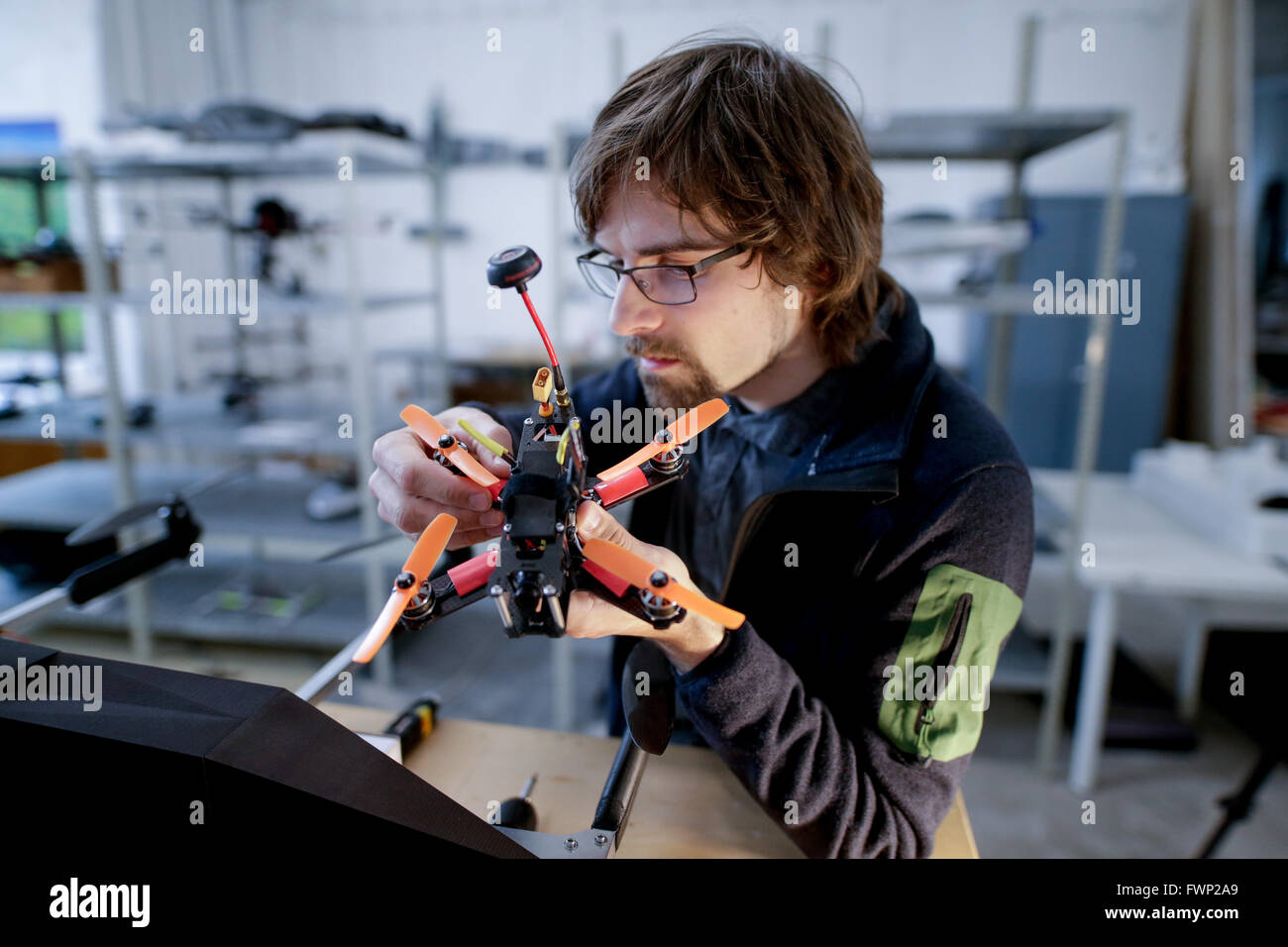 Development engineer for drones, Gerd Jacobs, holds a race copter, a ...