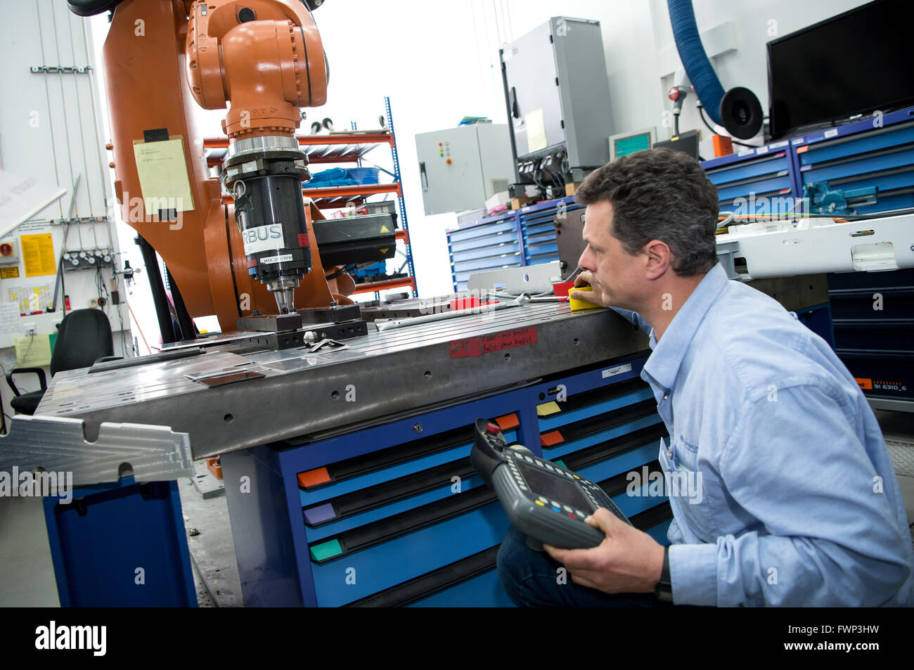 Taufkirchen, Germany. 07th Apr, 2016. Tommy Brunzel operates a welder ...