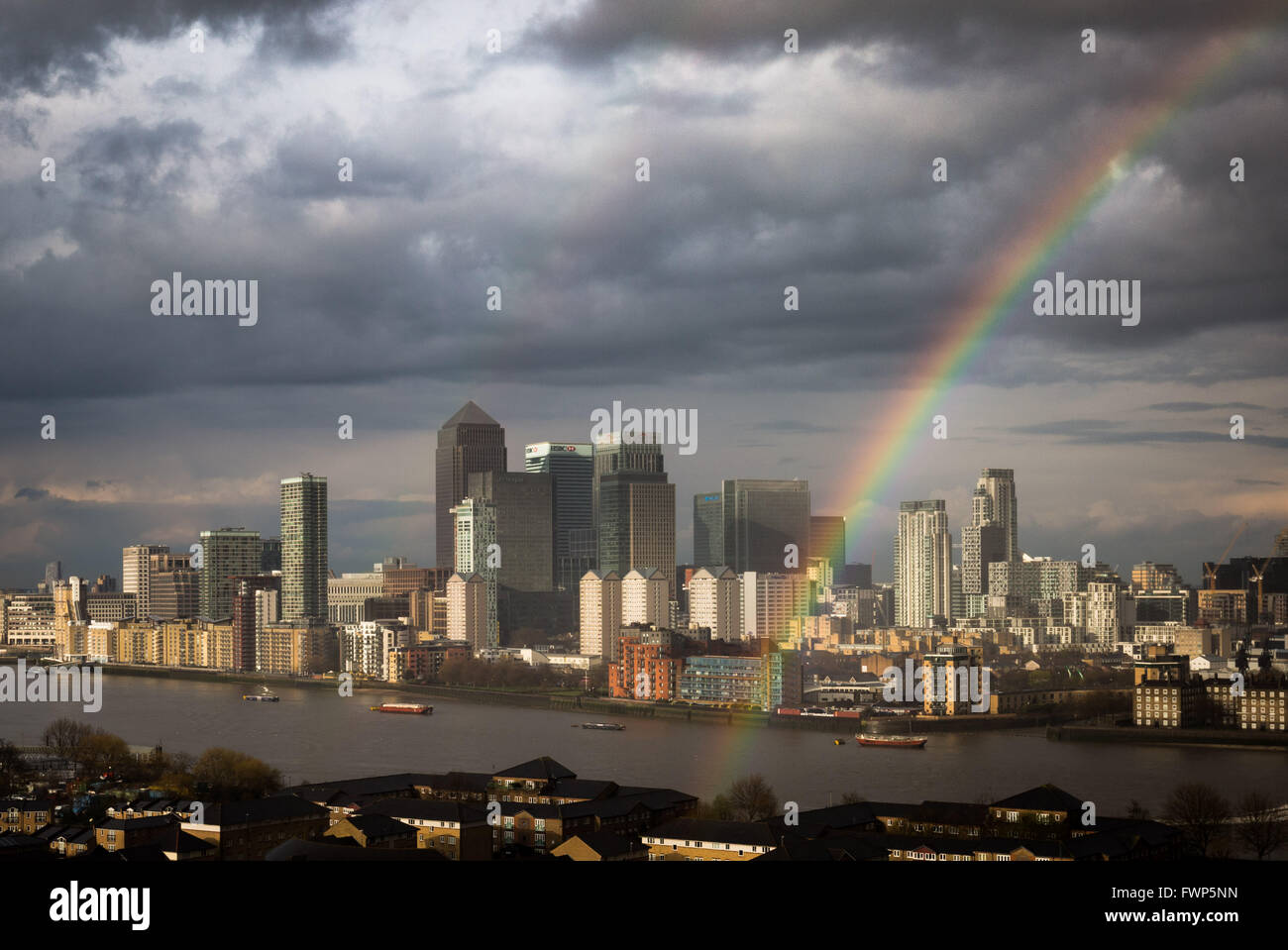 London, UK. 7th April, 2016. UK Weather: Colourful rainbow breaks ...