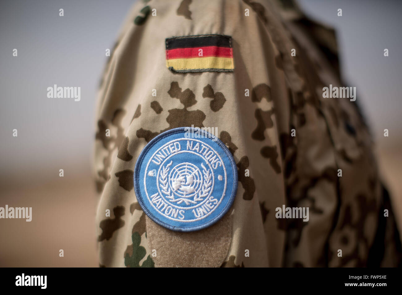 Gao, Mali. 05th Apr, 2016. A member of the German armed forces wears a ...