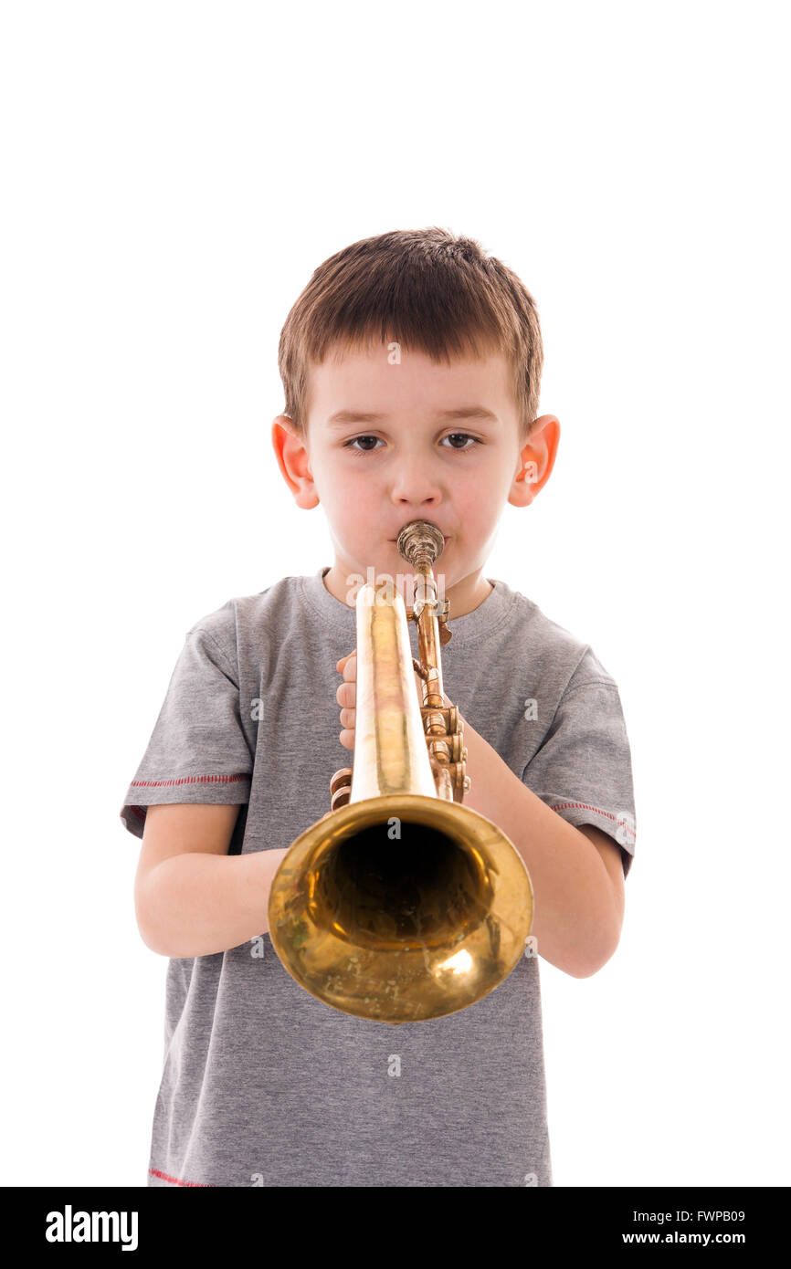 young boy blowing into a trumpet against white background Stock Photo ...
