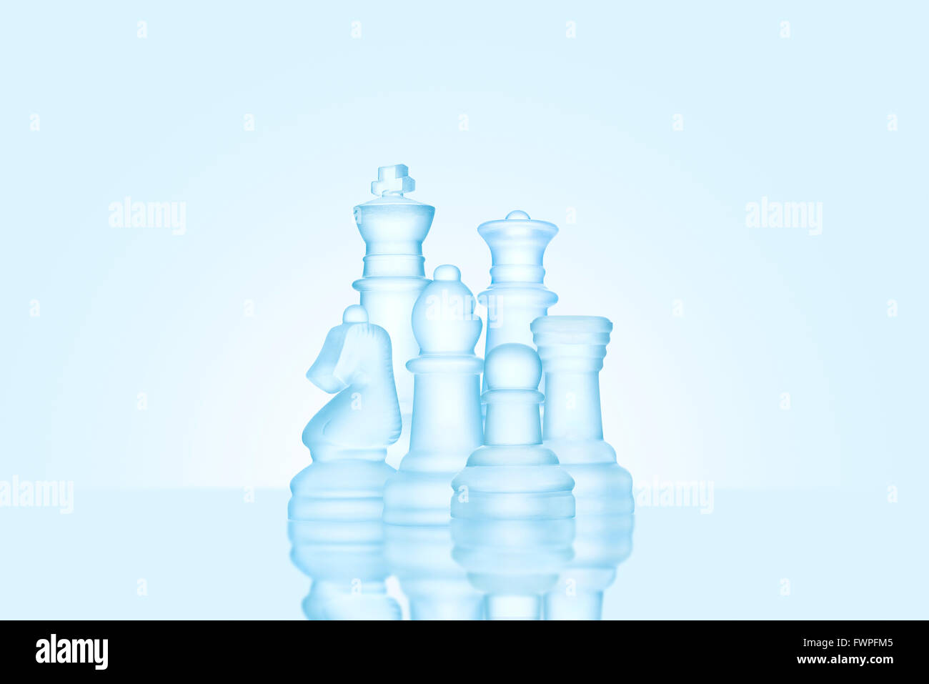 Strategy and leadership concept; frosted chess figures made of ice ...