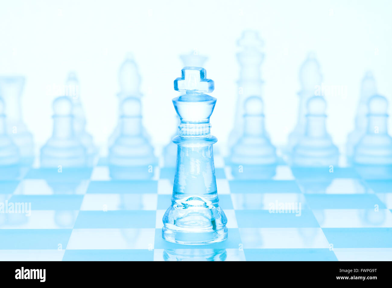 Chess game concept of an icy frosted king standing in front of chess ...