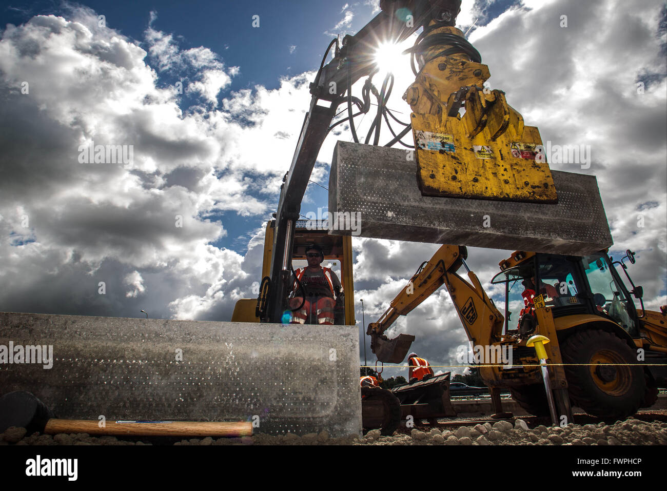 Railway workers building new railway Stock Photo - Alamy