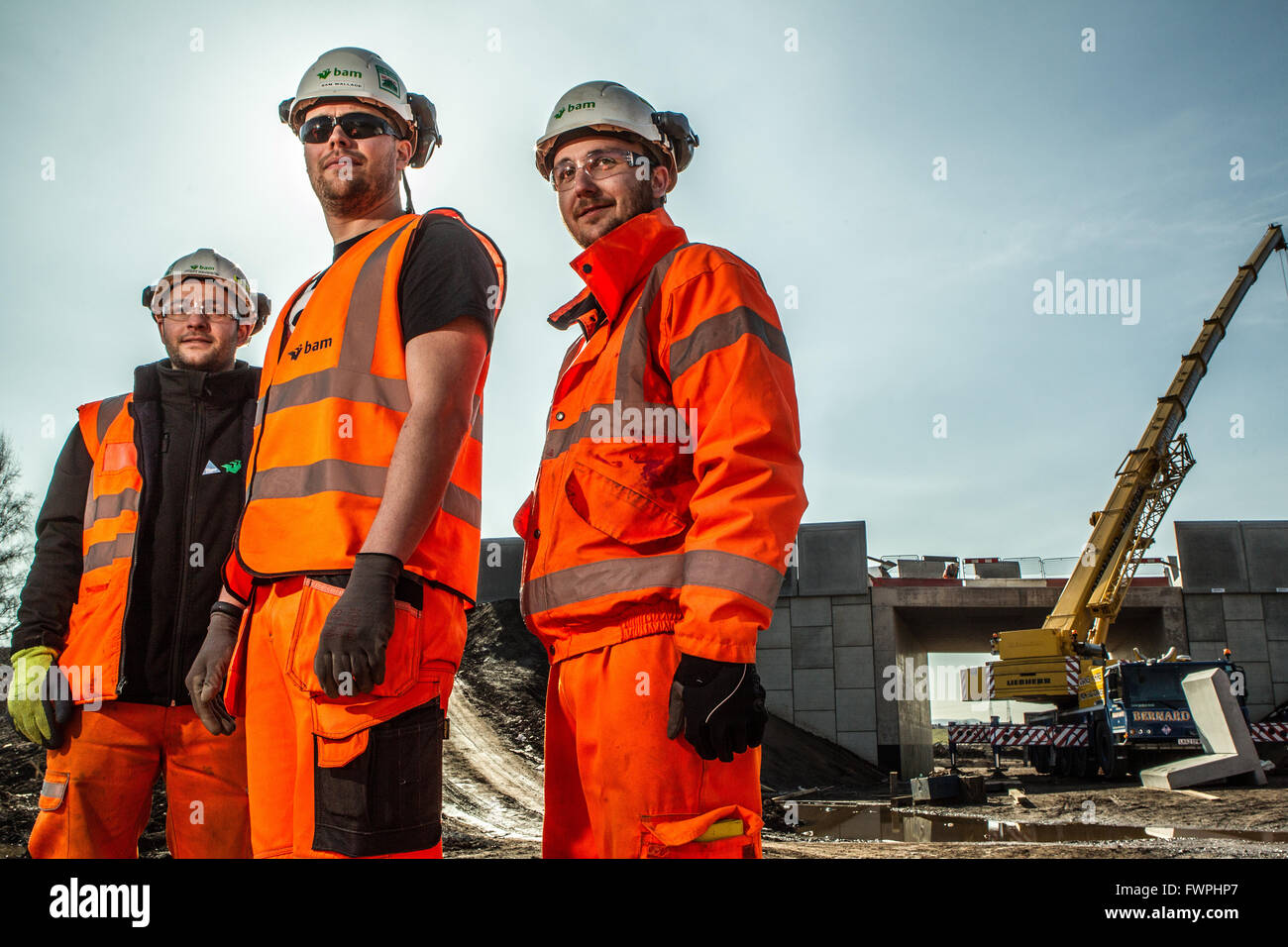 Railway workers building new railway Stock Photo - Alamy