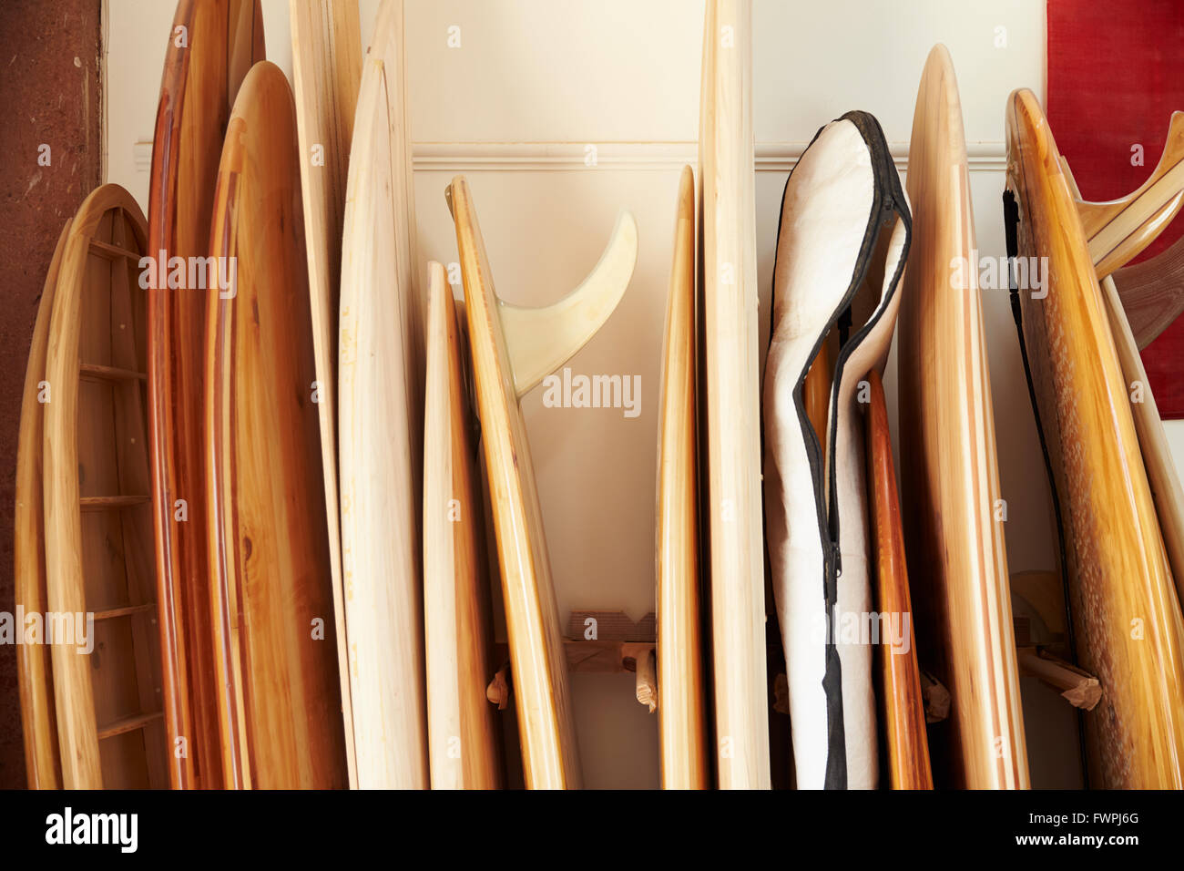 Row Of Handmade Boards In Bespoke Surfboard Workshop Stock Photo - Alamy