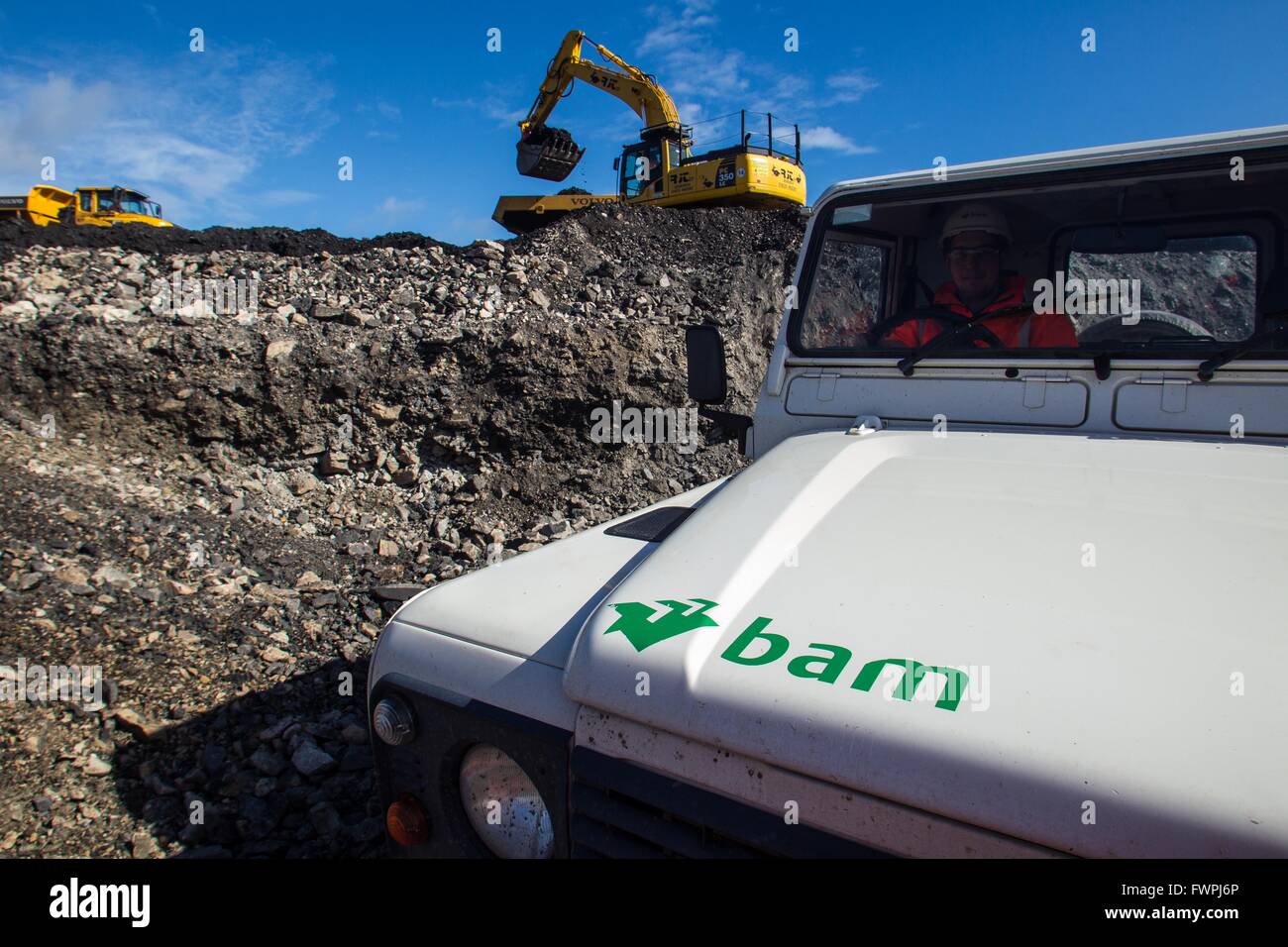 Diggers working during construction of Borders Railway, clearing rocks ...