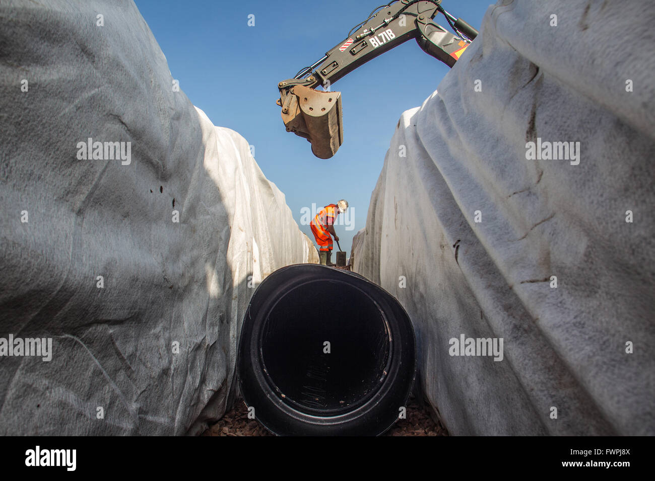 Construction worker in drainage pit during Borders Railway Construction ...