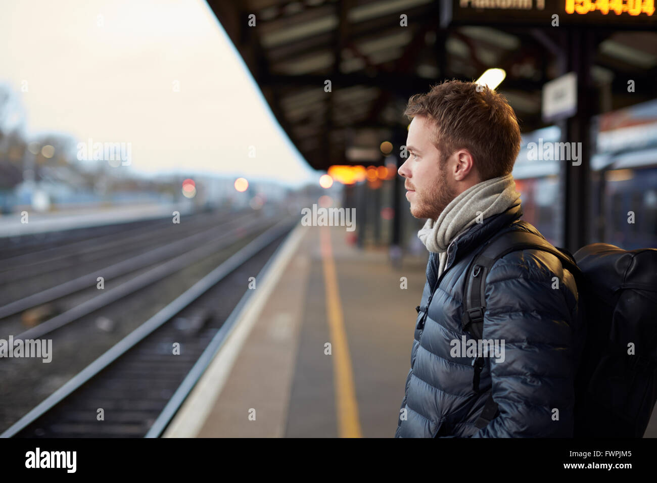 Man Standing On Railway Platform Waiting For Train To Arrive Stock ...