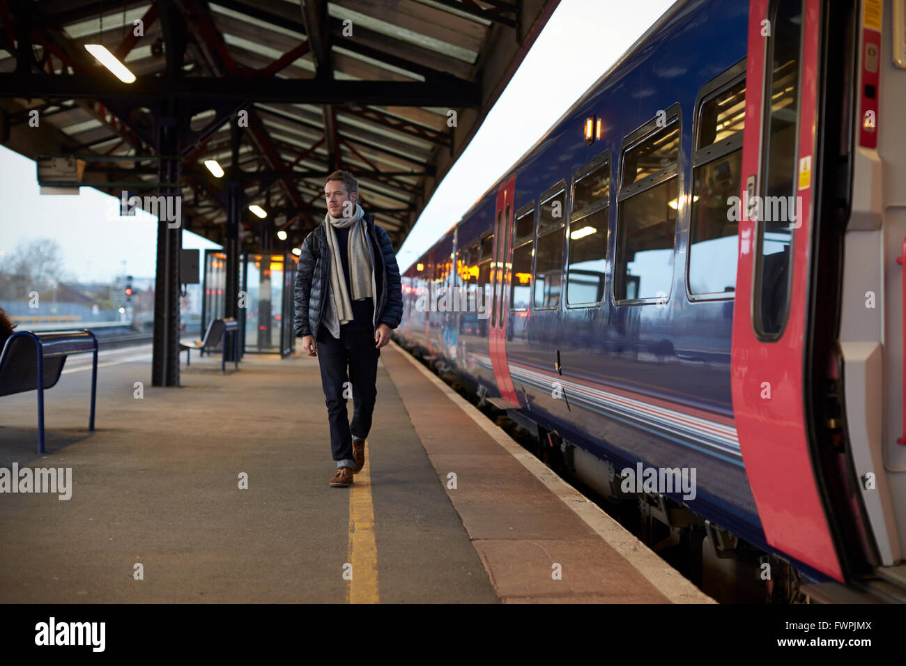 Man standing on railway platform hi-res stock photography and images ...