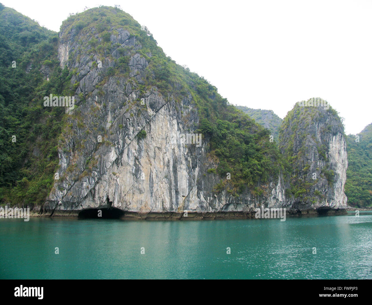 Rocky limestone islands in Halong Bay, Vietnam Stock Photo - Alamy