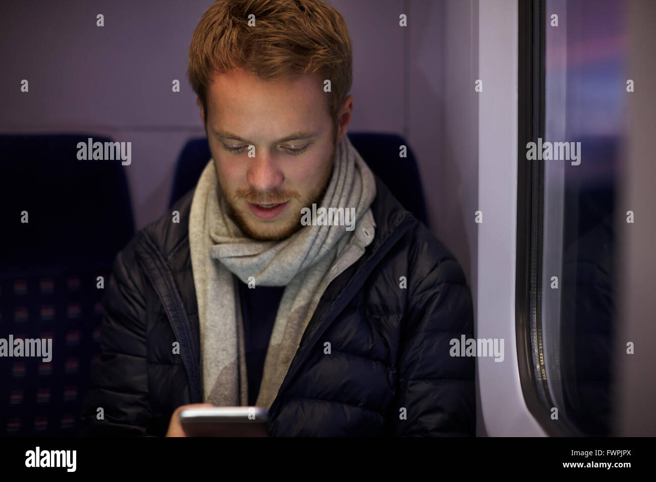 Male passenger sending text hi-res stock photography and images - Alamy