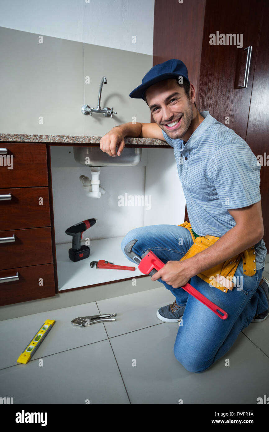 Portrait happy man holding pipe hi-res stock photography and images - Alamy