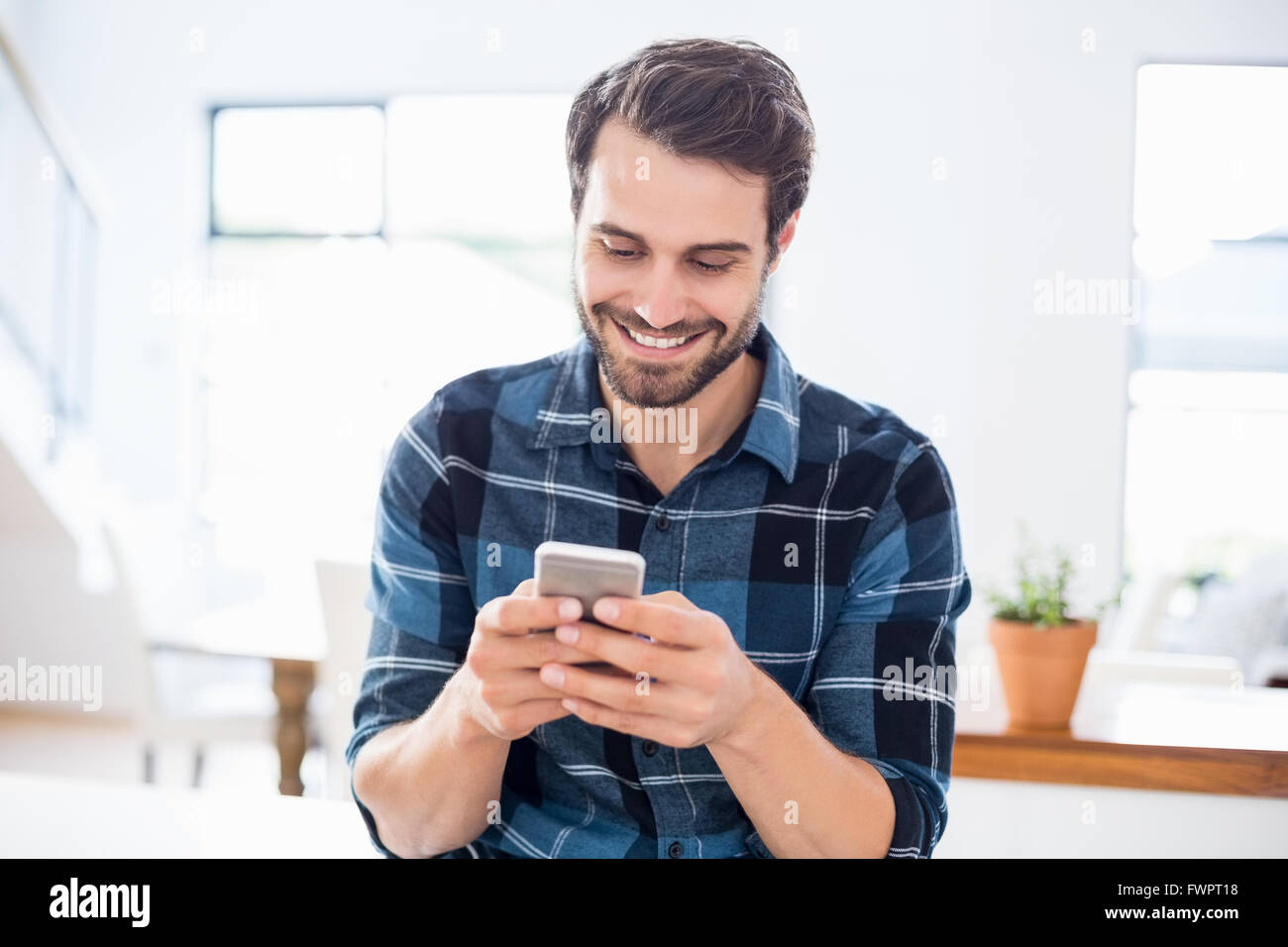 Happy man using mobile phone Stock Photo - Alamy