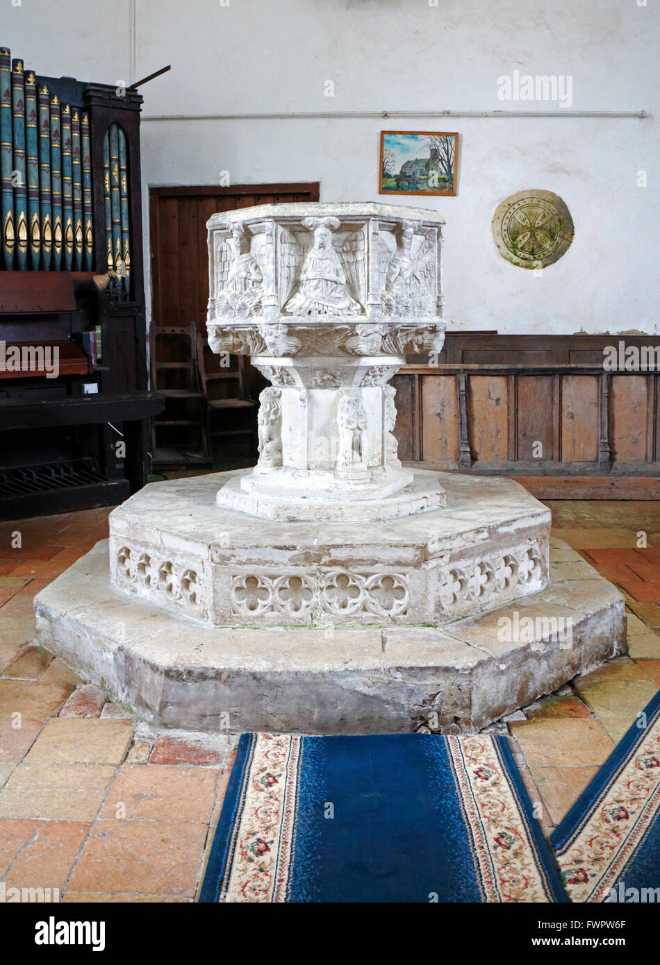 A view of the 15th century font in the church of St Margaret at Hardley ...