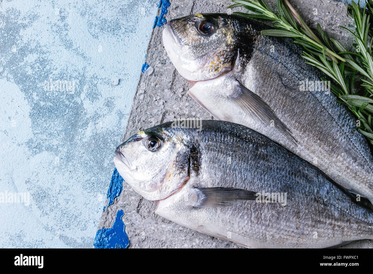 Raw bream fish with herbs Stock Photo - Alamy