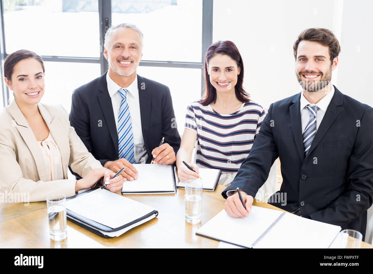 Workers are smiling and posing Stock Photo - Alamy