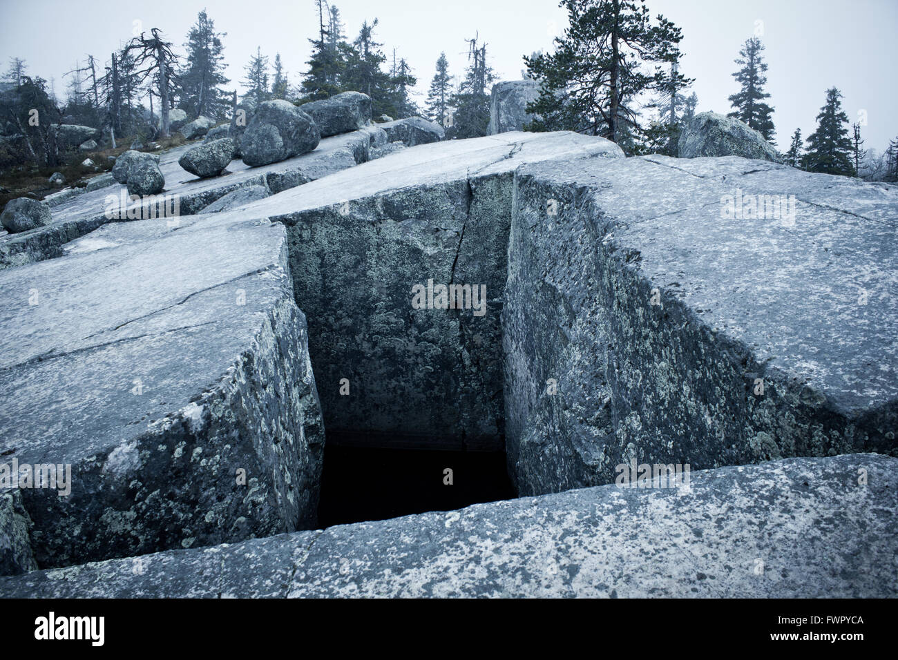 Rock slope with a square hole Stock Photo - Alamy