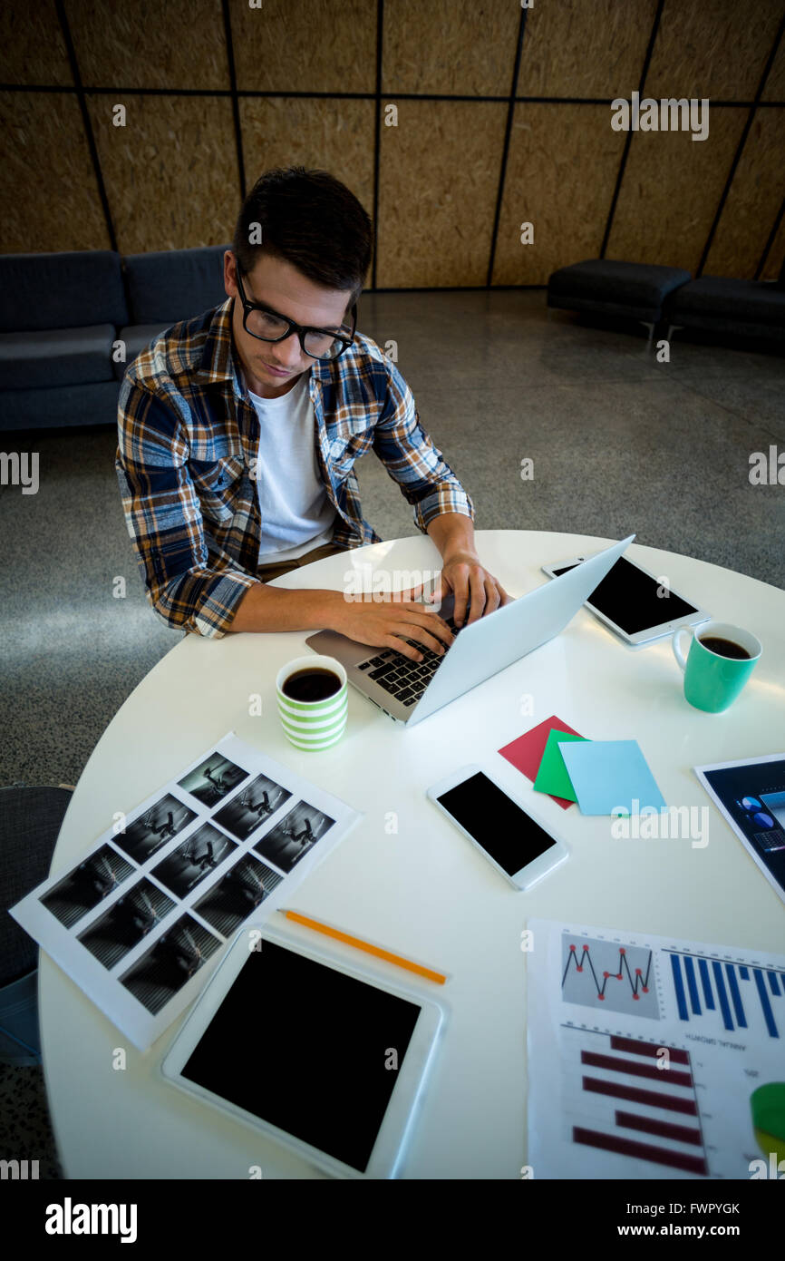 Man working at his desk Stock Photo - Alamy