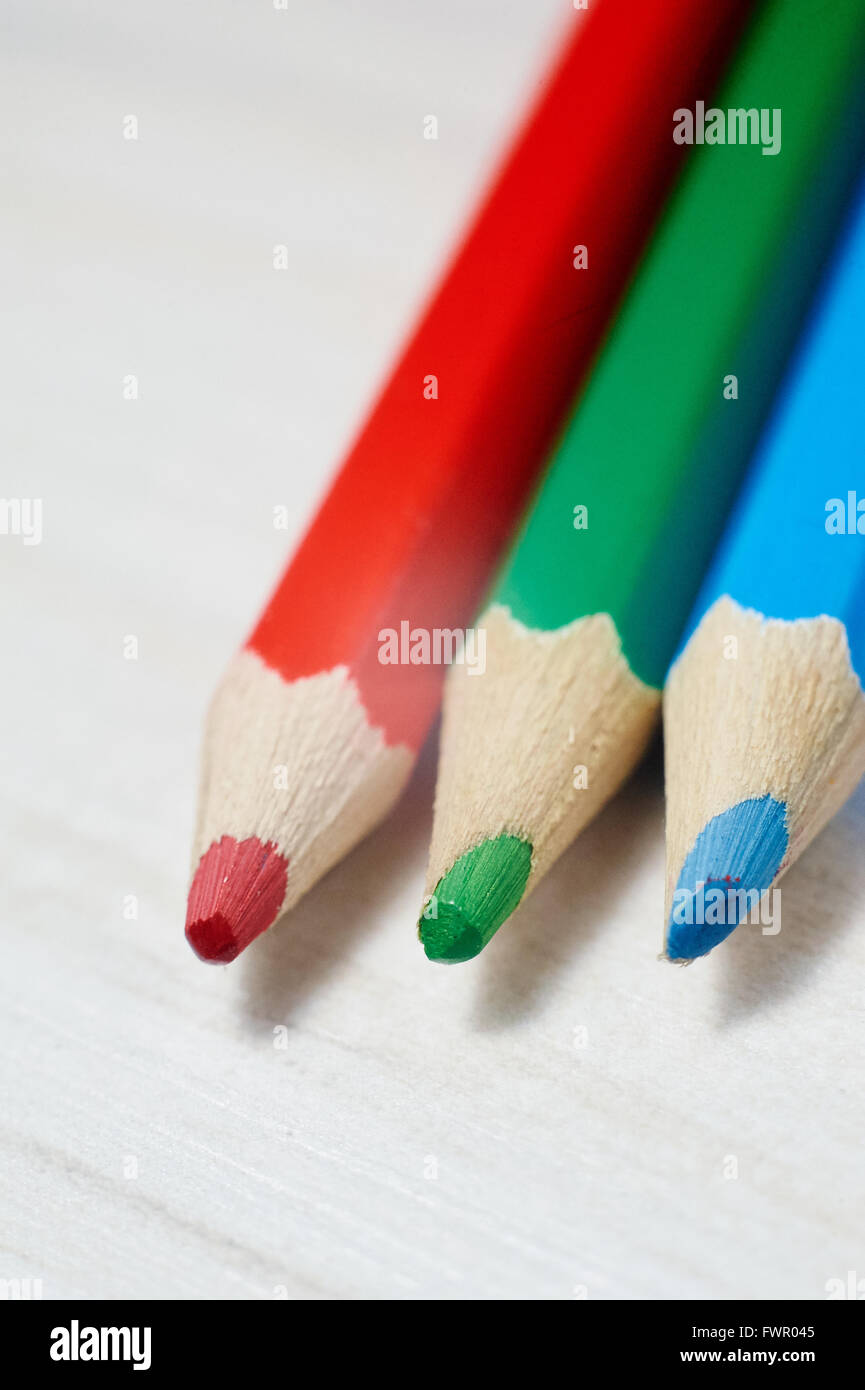 Stack of colored pencils on white table. Studio shot Stock Photo - Alamy