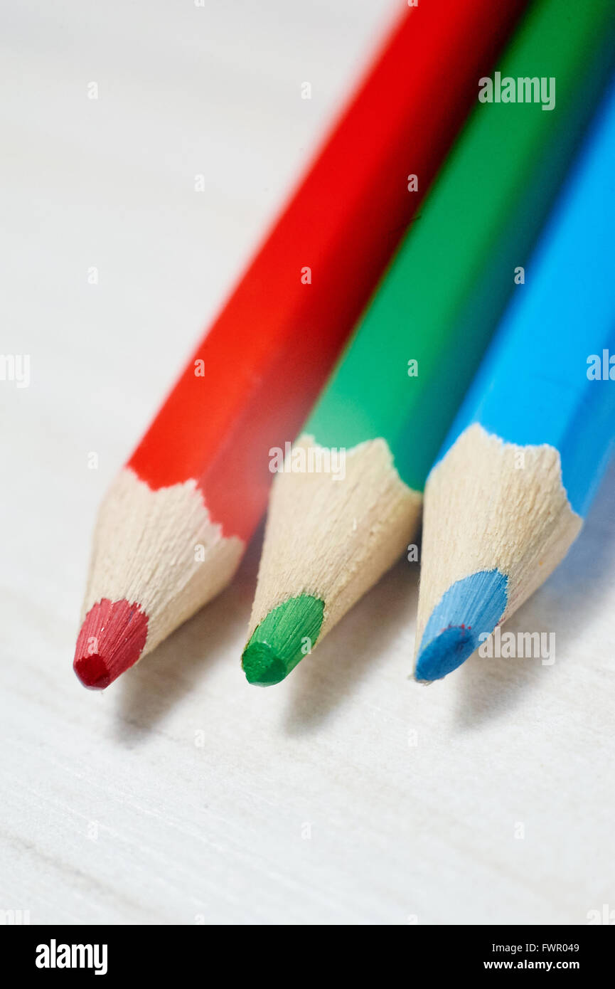 Stack of colored pencils on white table. Studio shot Stock Photo - Alamy