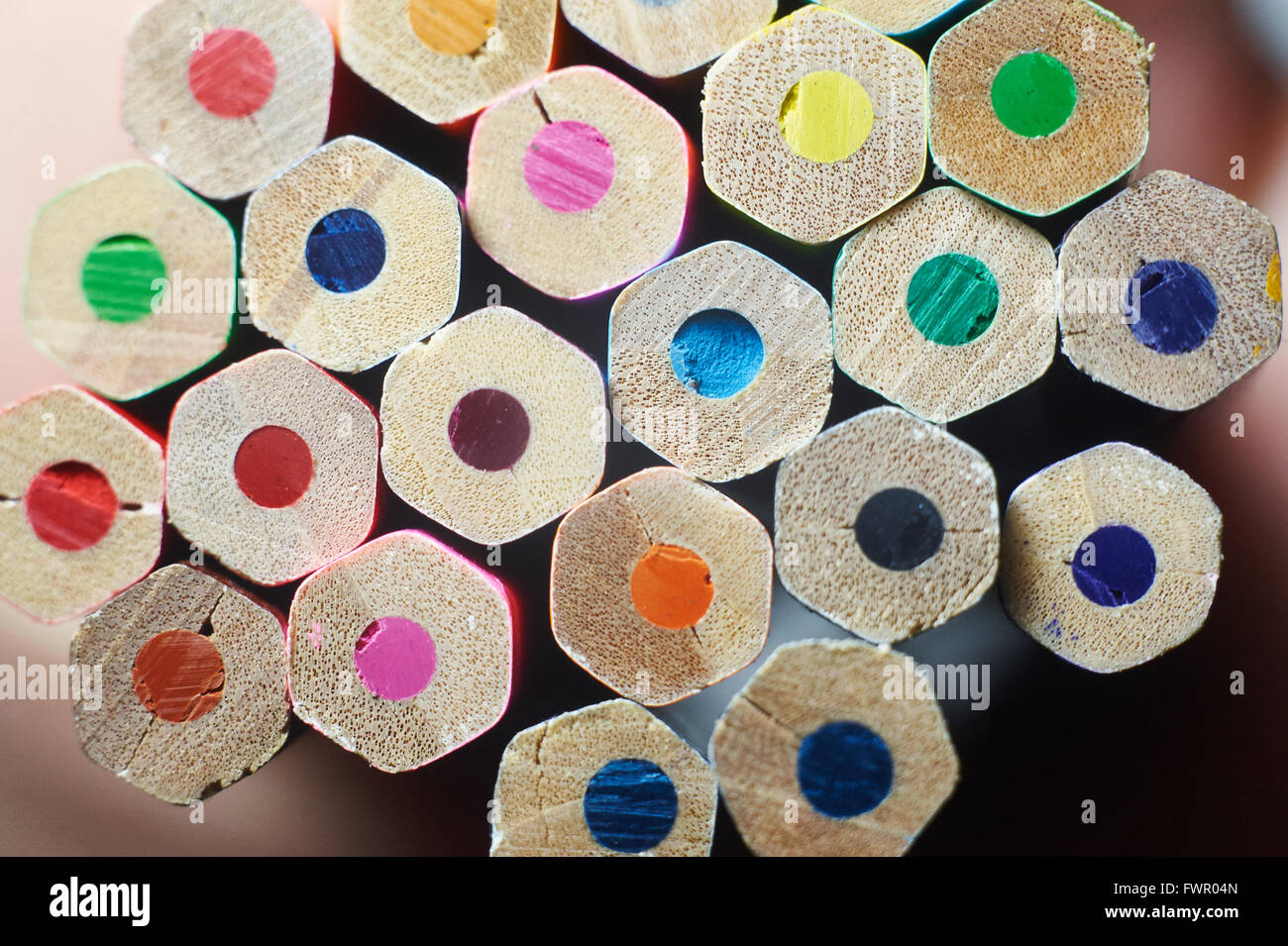 Stack of colored pencils on white table. Studio shot Stock Photo - Alamy