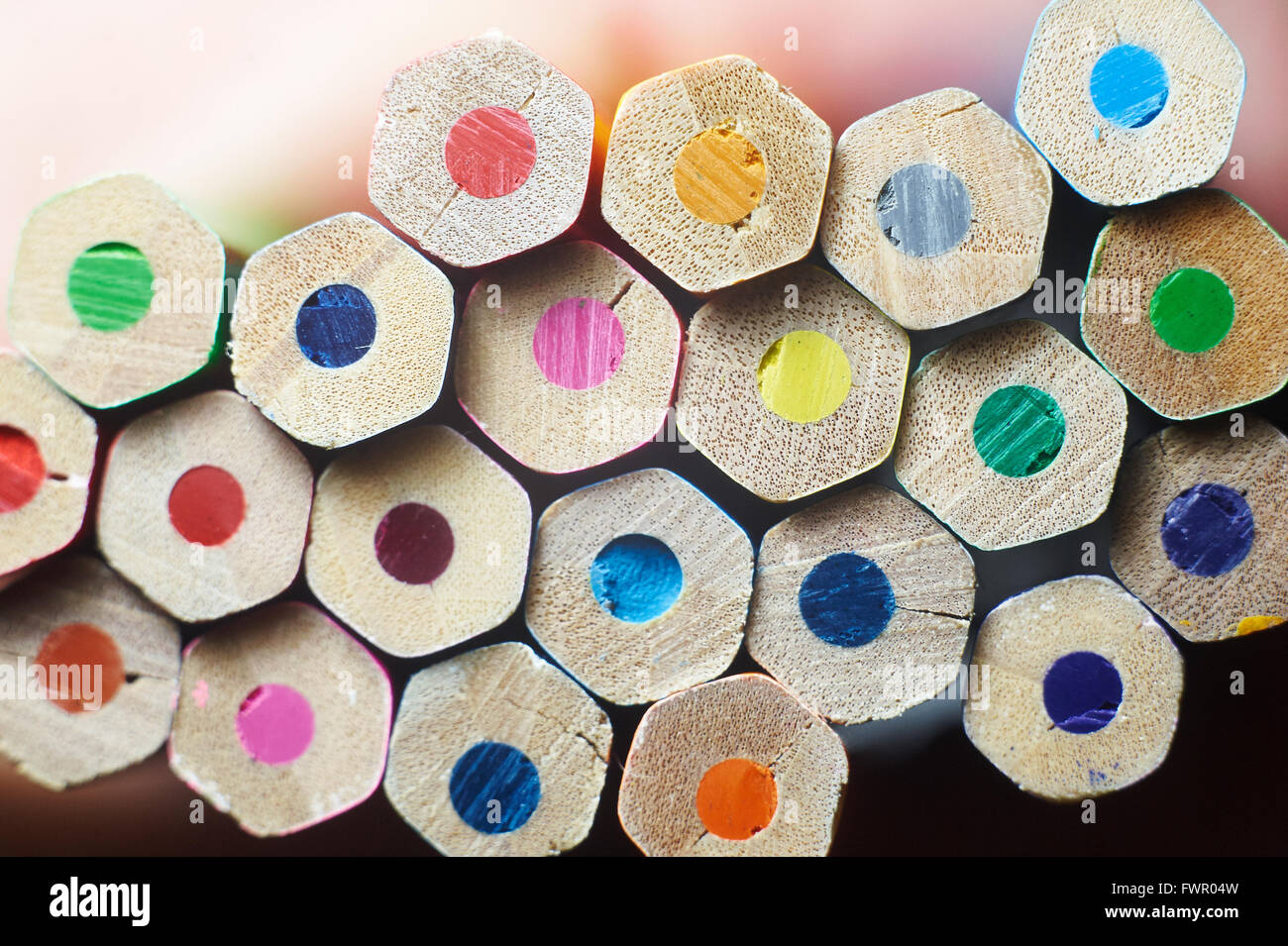 Stack of colored pencils on white table. Studio shot Stock Photo - Alamy