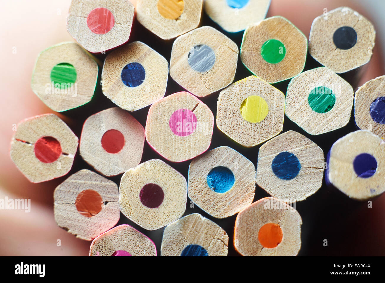 Stack of colored pencils on white table. Studio shot Stock Photo - Alamy