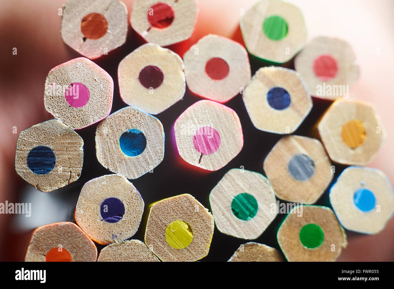 Stack of colored pencils on white table. Studio shot Stock Photo - Alamy