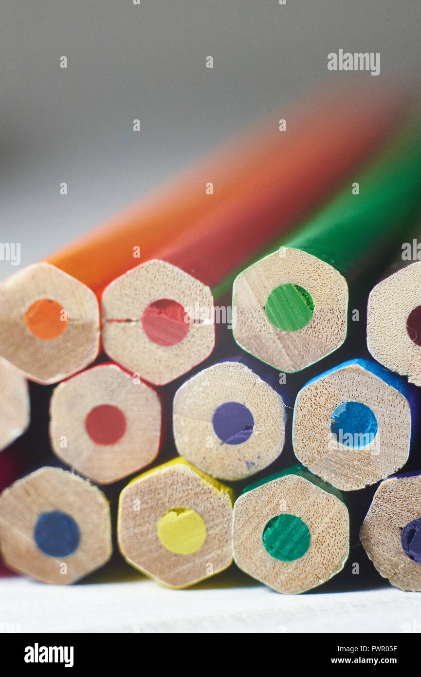 Stack of colored pencils on white table. Studio shot Stock Photo - Alamy