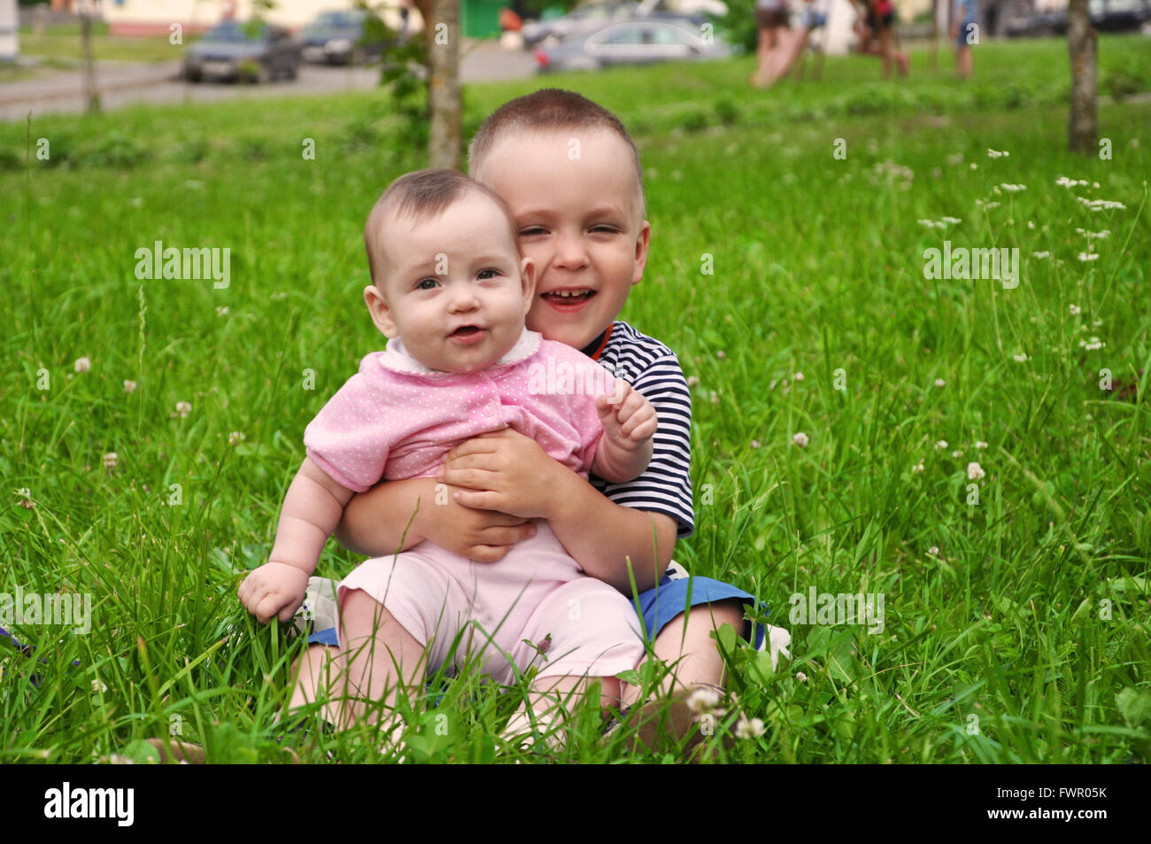 children playing on the grass Stock Photo - Alamy