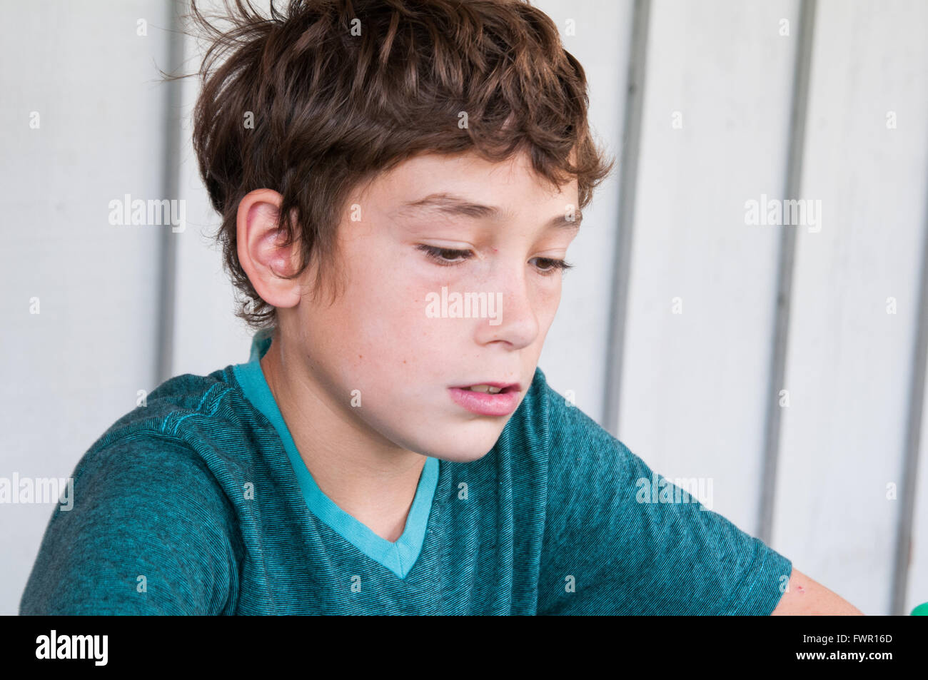 young boy concentrating on a project Stock Photo - Alamy