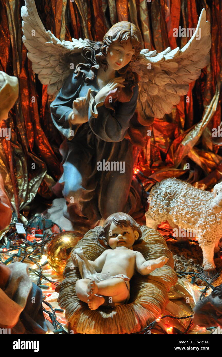 Angel and a baby in a manger Stock Photo - Alamy