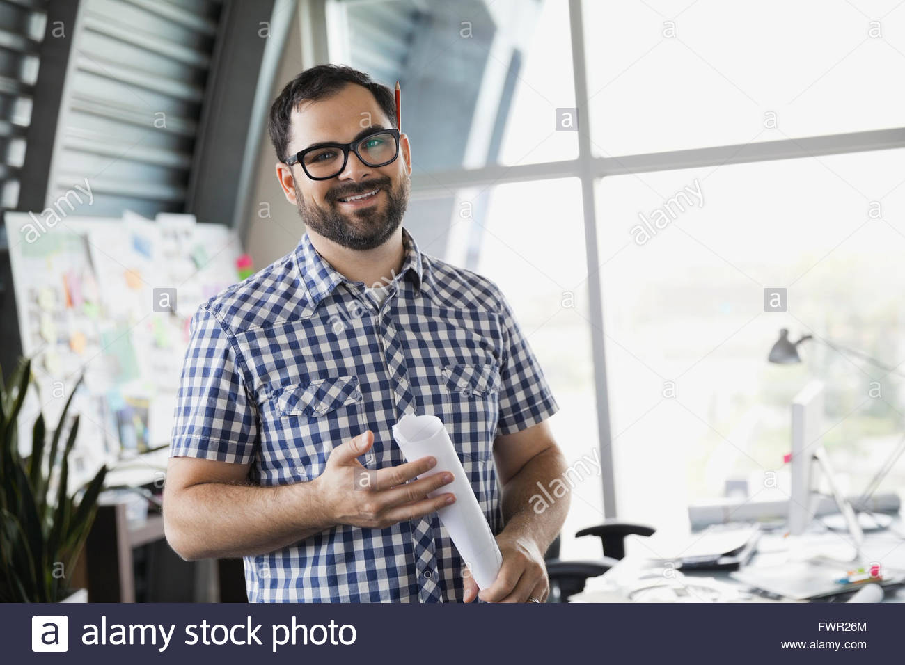 Businessman with blueprints hi-res stock photography and images - Alamy