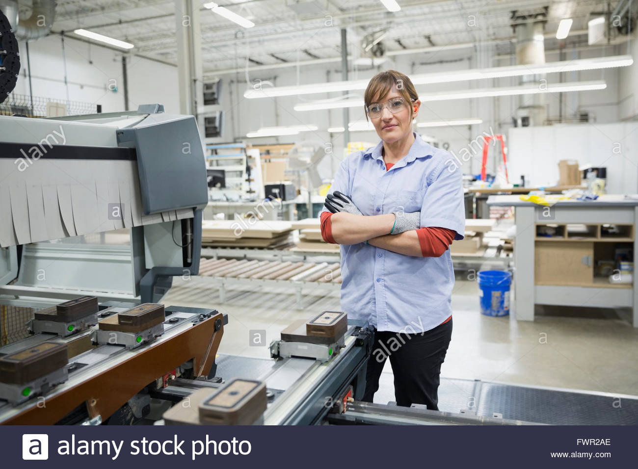 Portrait female factory standing arms hi-res stock photography and ...